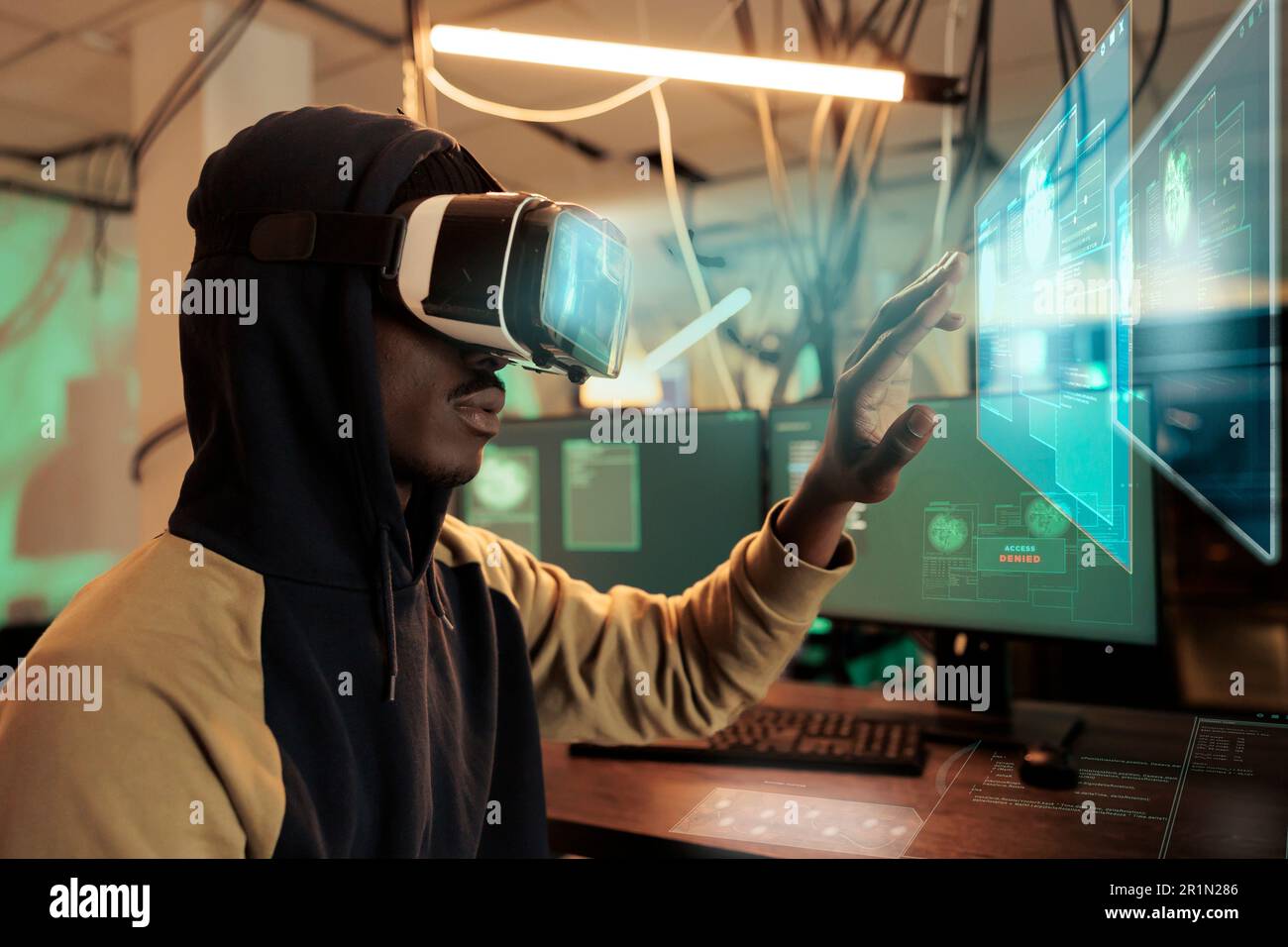 African american hacker breaching database with holograms Stock Photo ...