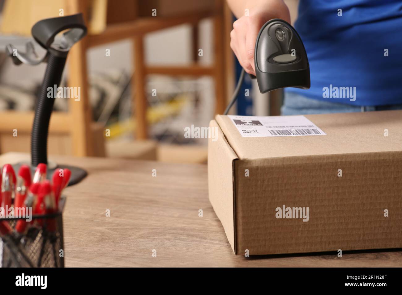 Woman scanner reading parcel hi-res stock photography and images - Alamy