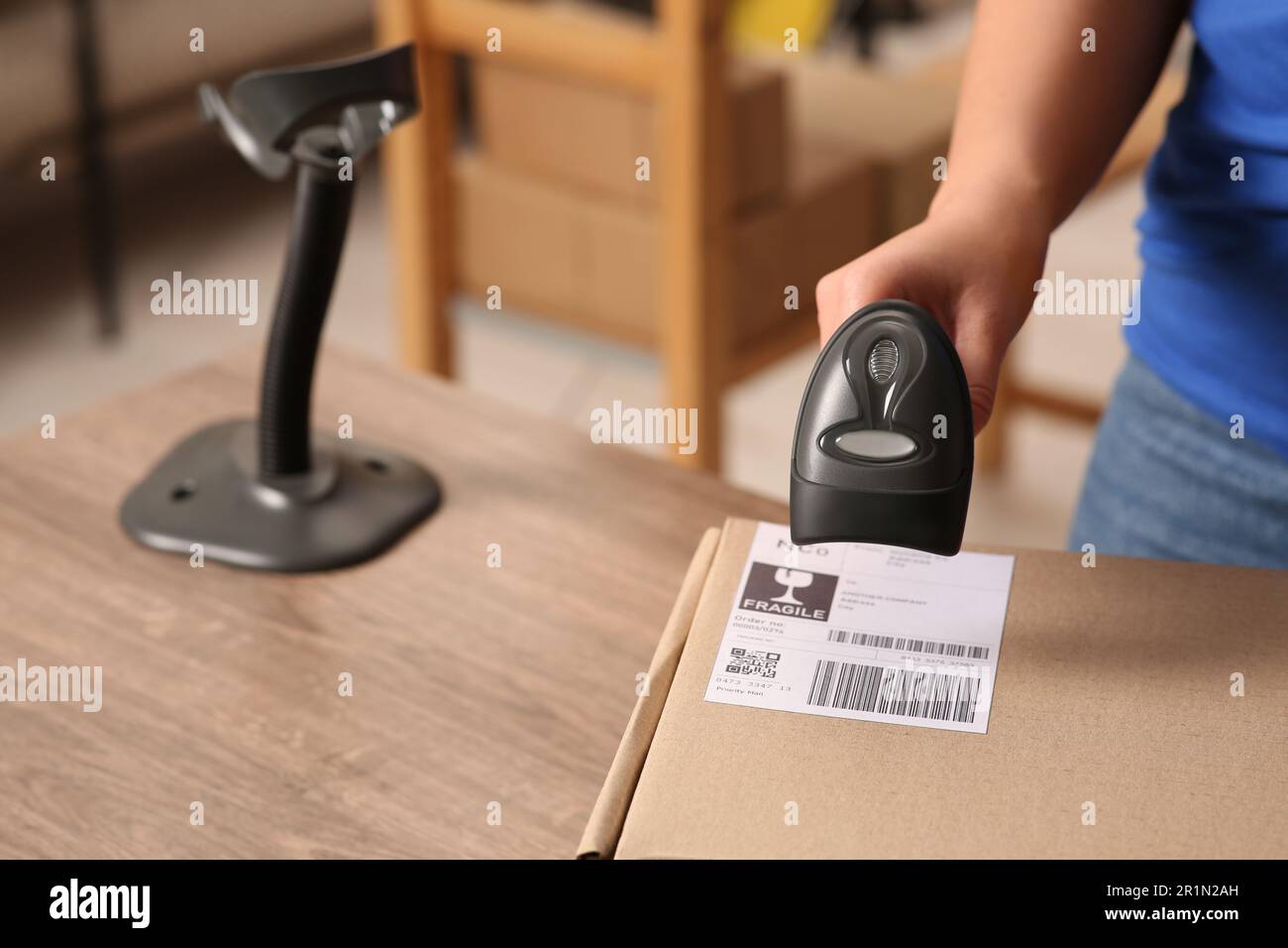 Woman scanner reading parcel hi-res stock photography and images - Alamy