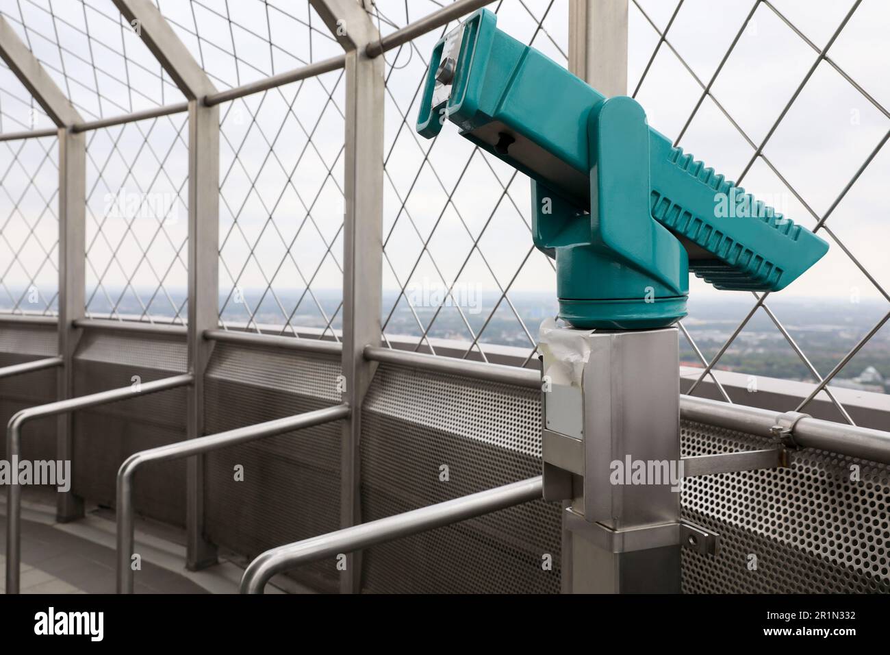 Green metal tower viewer on observation deck Stock Photo - Alamy