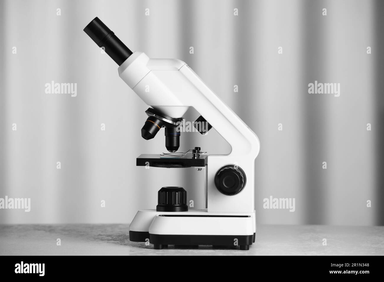 Modern microscope on table indoors. Medical equipment Stock Photo - Alamy