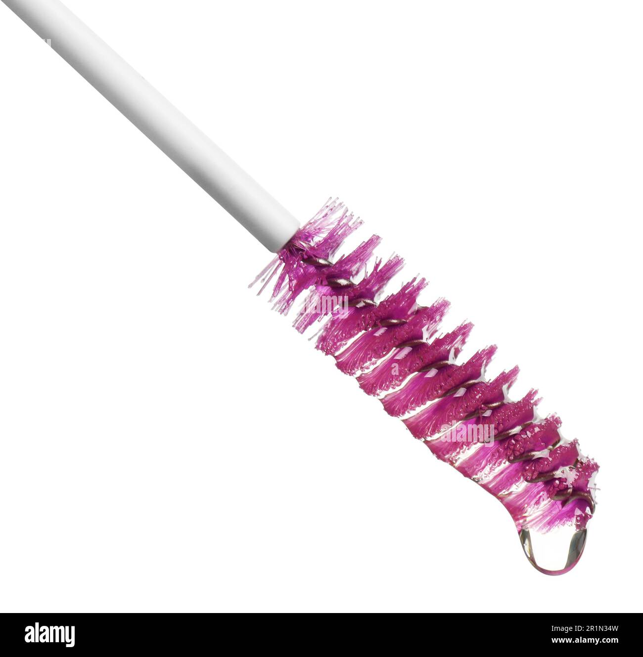 Drop of eyelash oil falling down from brush on white background Stock ...
