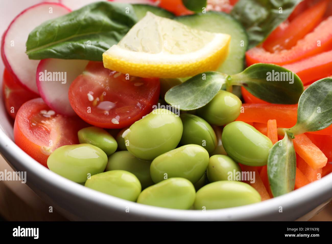 Closeup view of poke bowl with salmon, edamame beans and vegetables ...