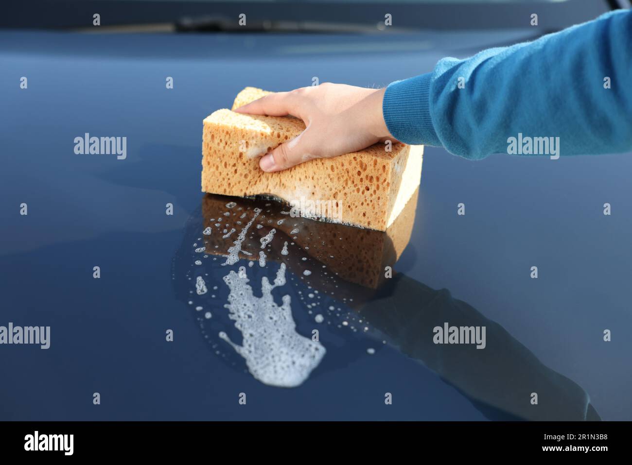 Man washing car hood hi-res stock photography and images - Alamy