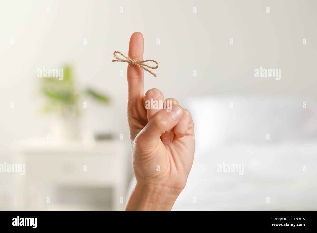 Woman index finger remember hi-res stock photography and images - Alamy