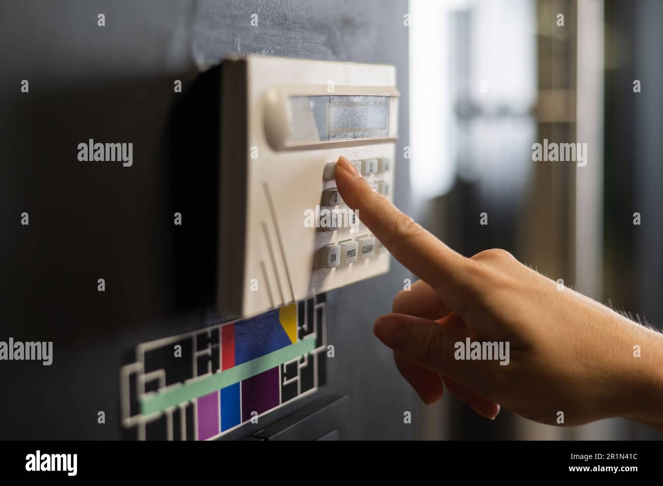Floor plan and switching lighting. The woman pressed the button Stock ...