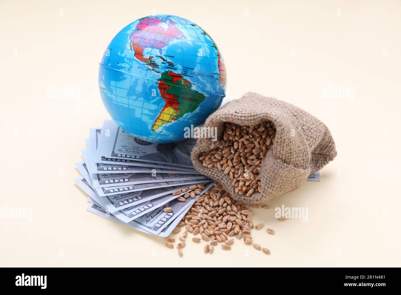 Import and export concept. Globe, bag of wheat grains and banknotes on ...