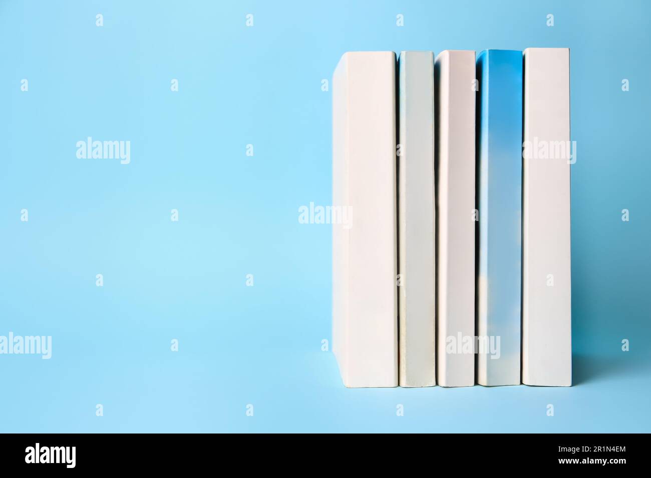 Collection of books on light blue background, space for text Stock ...