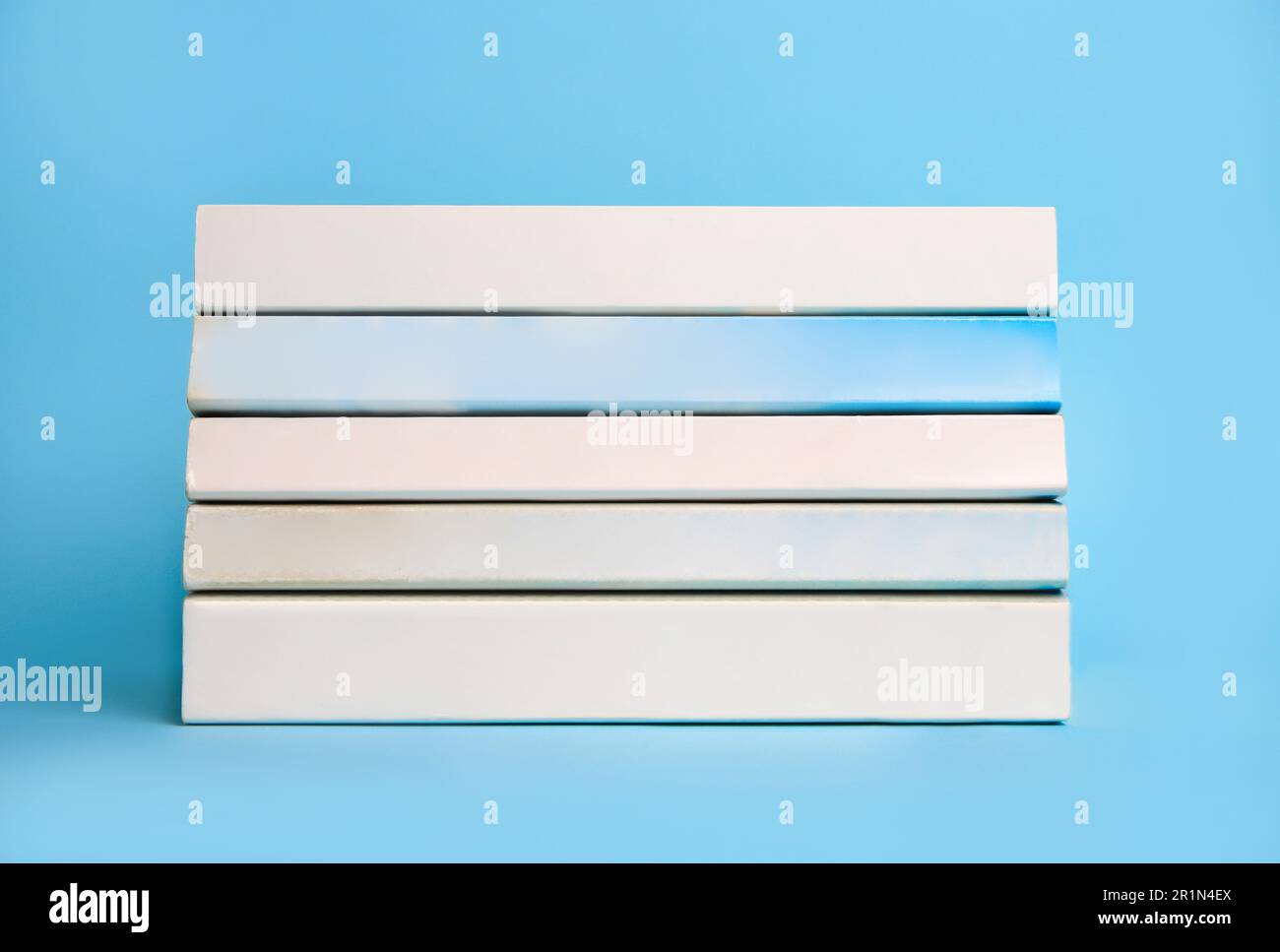 Collection of books on light blue background Stock Photo - Alamy