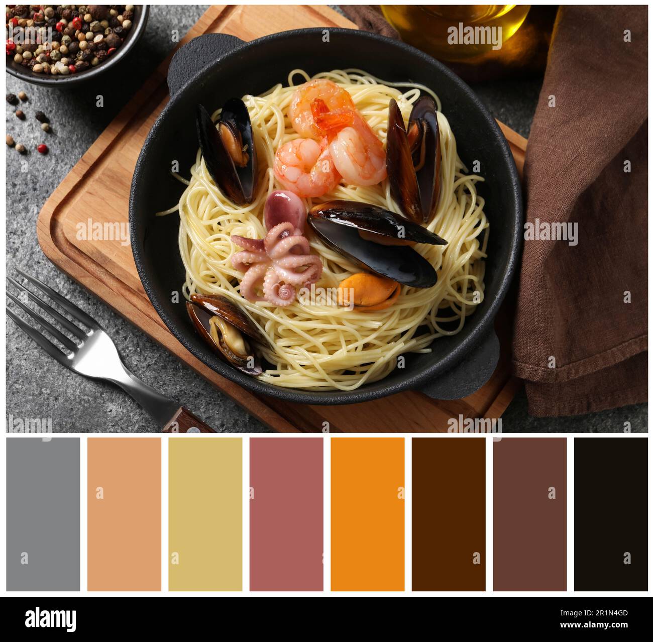 Flat lay composition with delicious pasta with seafood served on grey ...