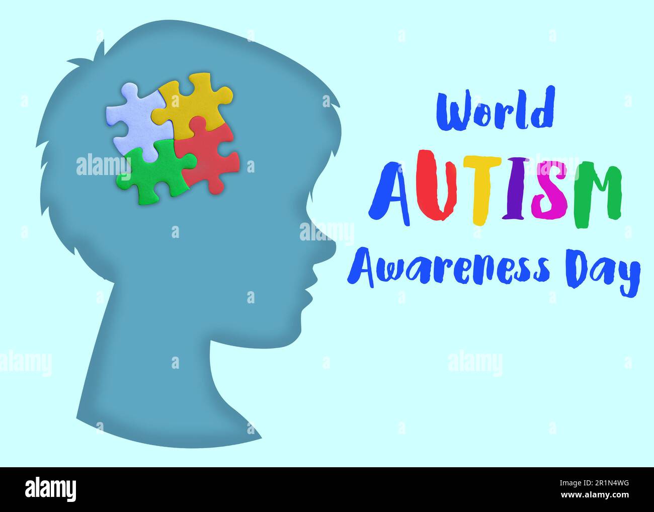 World Autism Awareness Day. Silhouette of boy with puzzle pieces in his ...