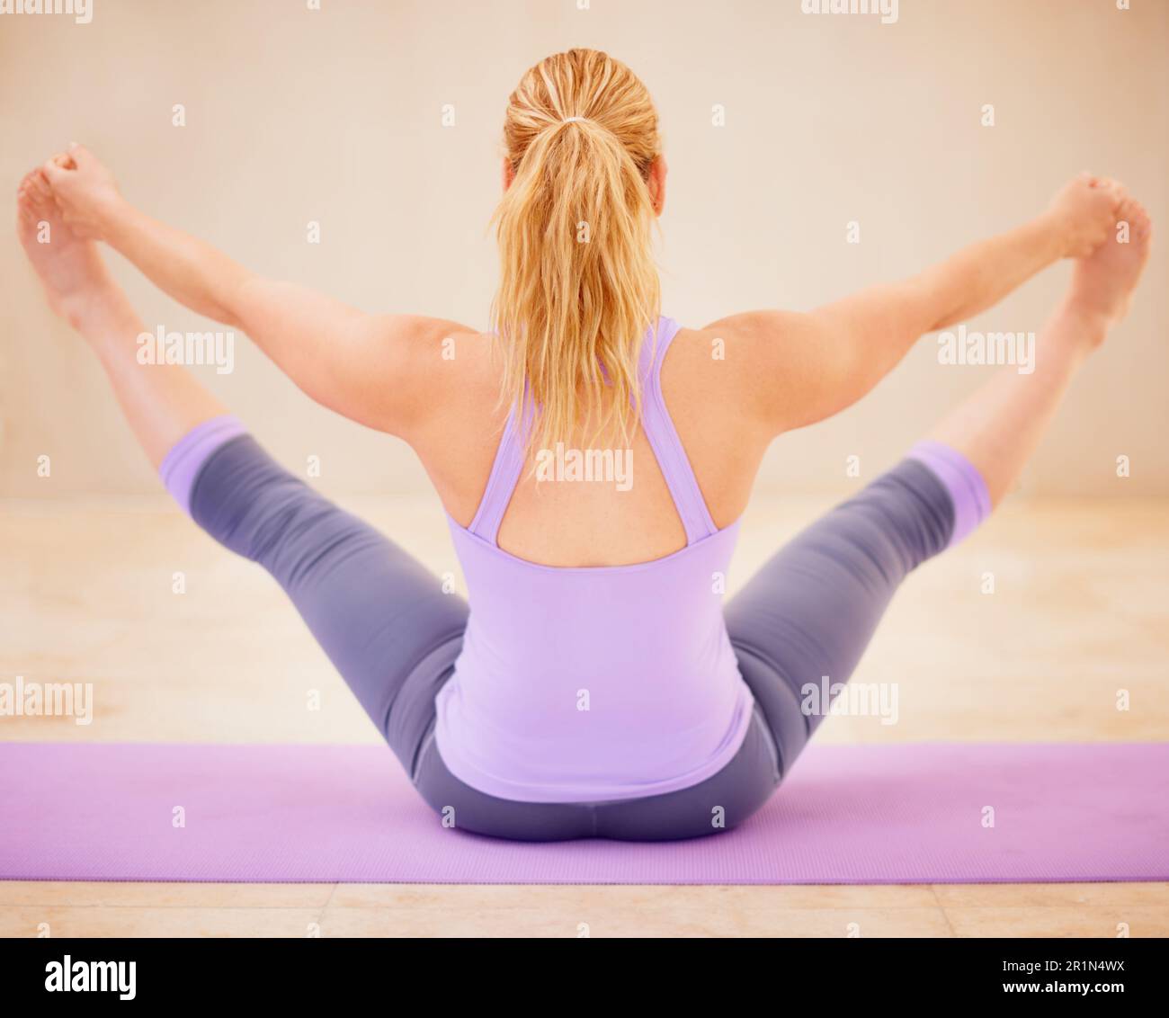 Stretching legs, yoga and back of woman on mat for flexibility ...