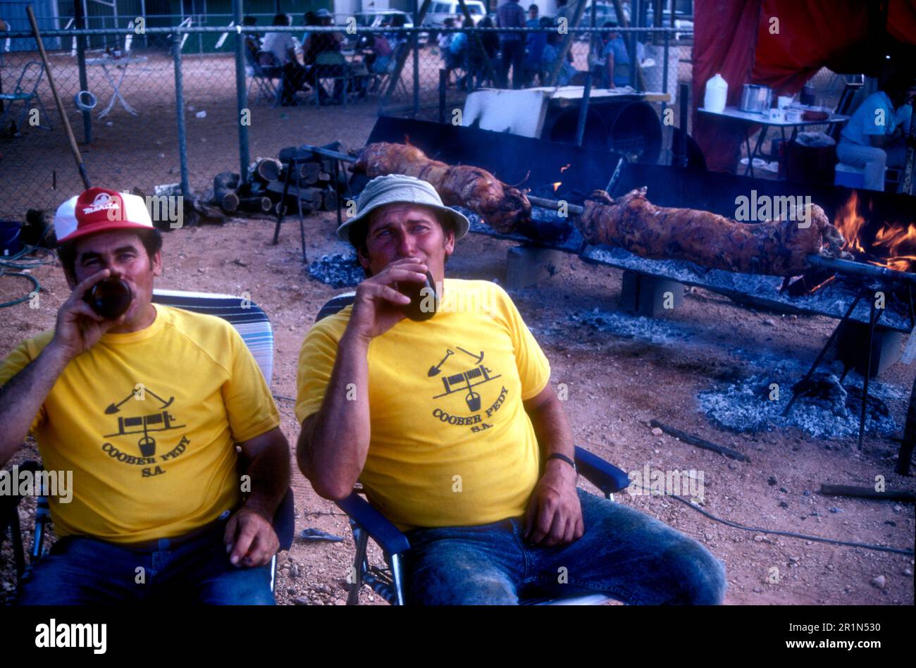 Miners drinking beer at the Saturday BBQ in Coober Pedy, opal mining ...