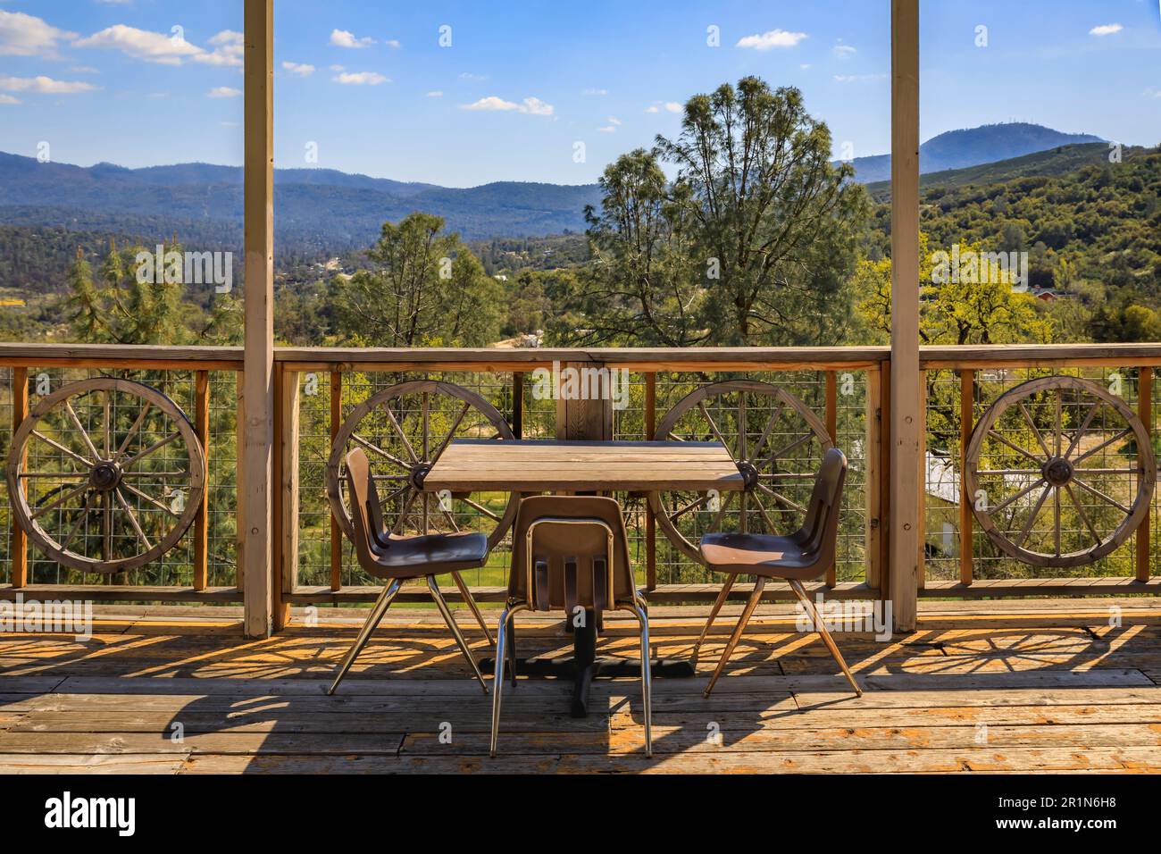 Outdoor table with a scenic view of a valley and Sierra Nevada mountain ...