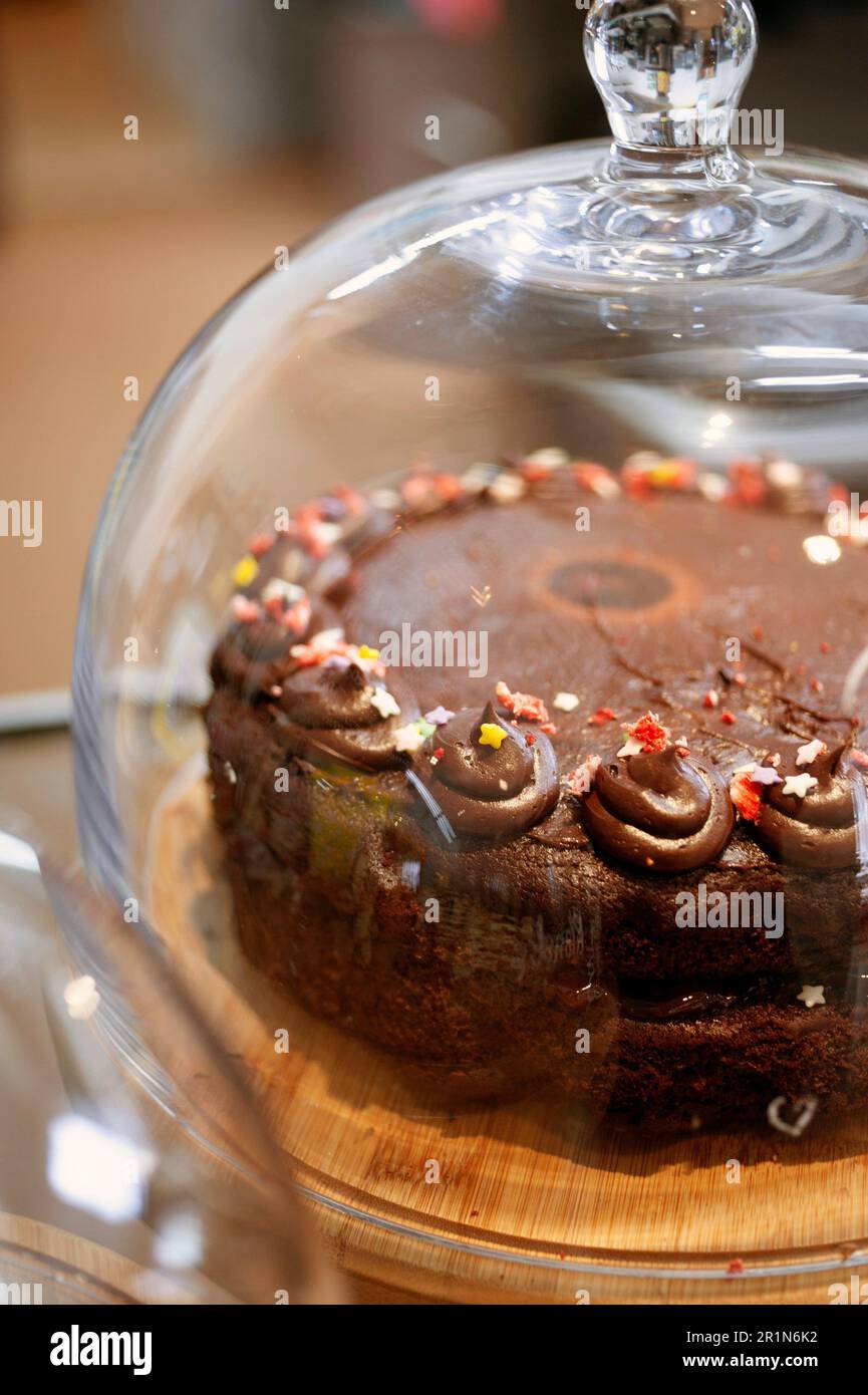 Chocolate cake under glass dome Stock Photo - Alamy