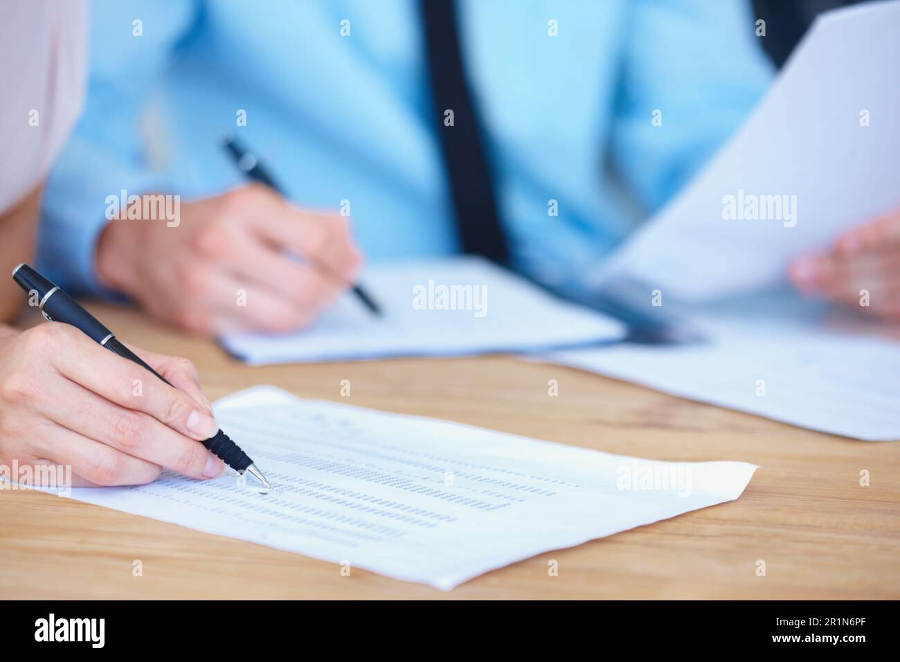 Business people, hands and writing on spreadsheet for finance paperwork ...