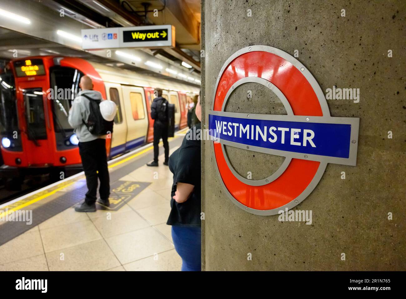 London, England, UK. Tube train arriving at the platform of Westminster ...