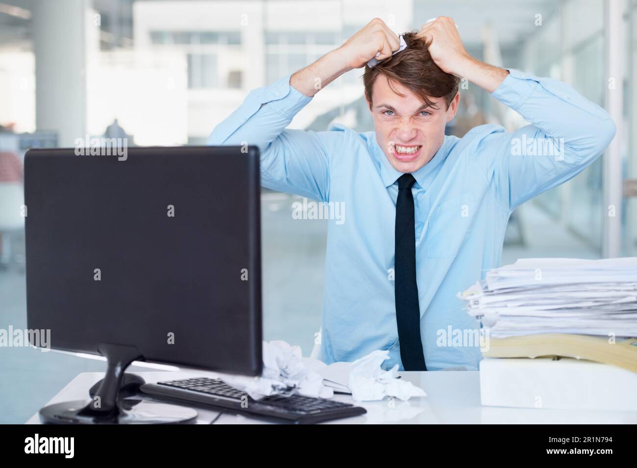 Portrait, stress or pulling hair with a businessman in an office ...