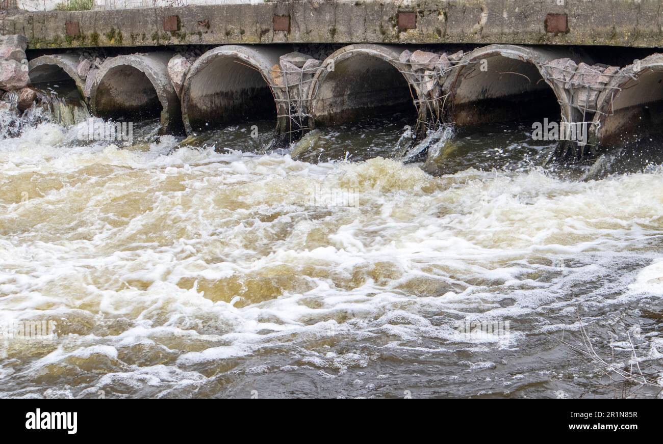 A concrete pipe that carries smelly, polluted sewage into the river ...