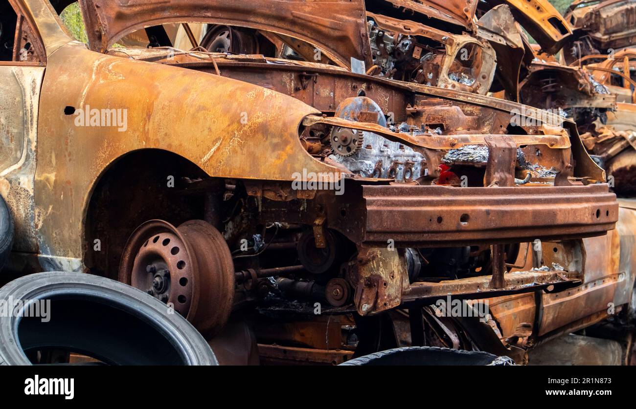 A lot of burnt fired cars in the parking lot, the consequences of the ...
