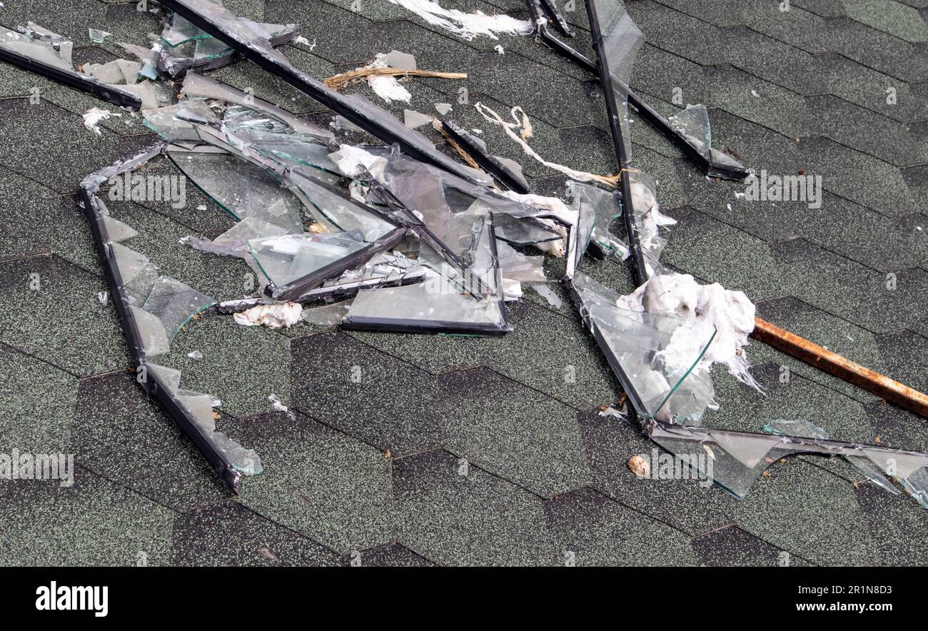 Broken roof after a storm. A large building with a damaged roof after a ...