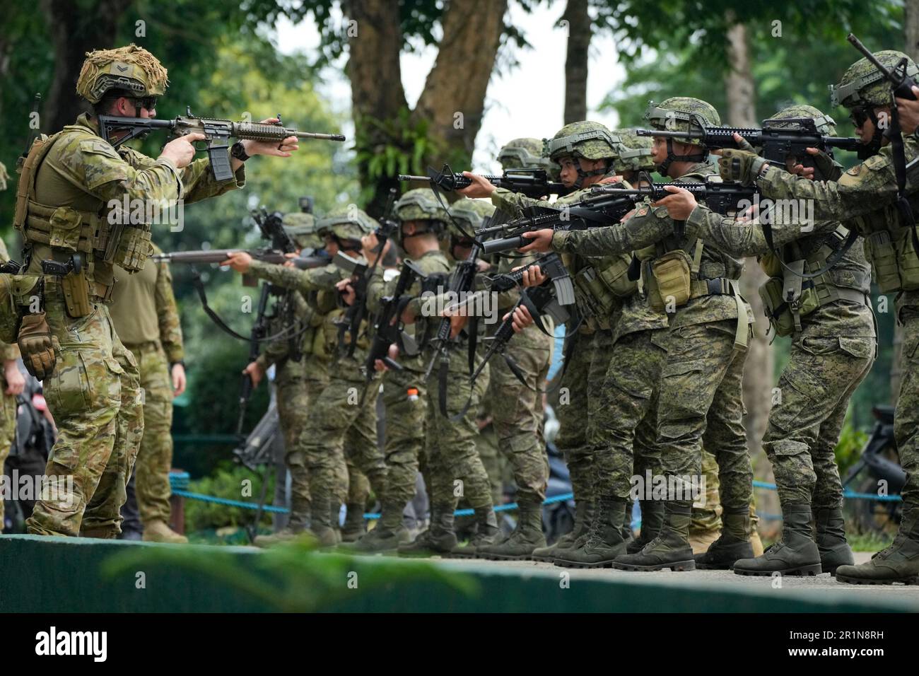 An Australian trooper, left, trains Philippine soldiers in Close Quarter Battle drills during an ...
