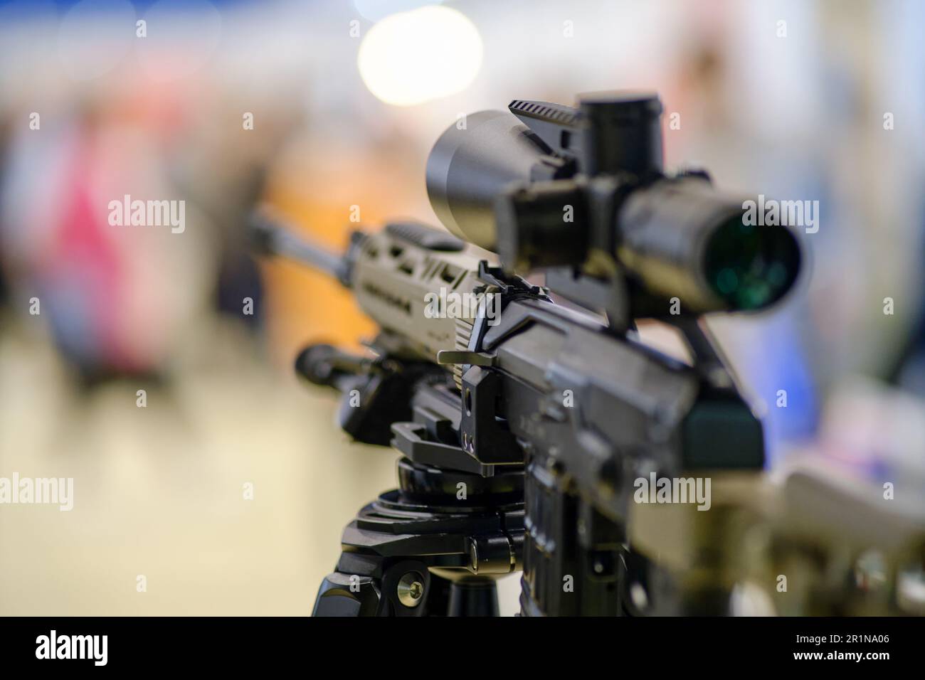 Sniper rifle with optical sight and people on the street Stock Photo ...