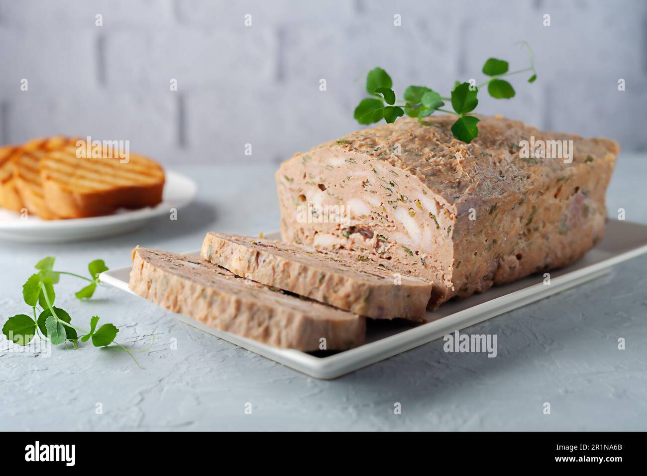Chicken terrine. Chicken meat pate with fresh parsley Stock Photo - Alamy