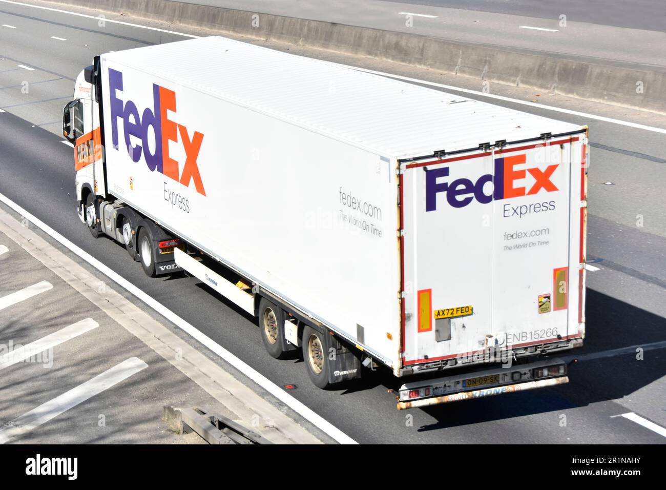 Side back rear aerial view HAM Transport business Volvo lorry truck power unit & FedEx Express ...