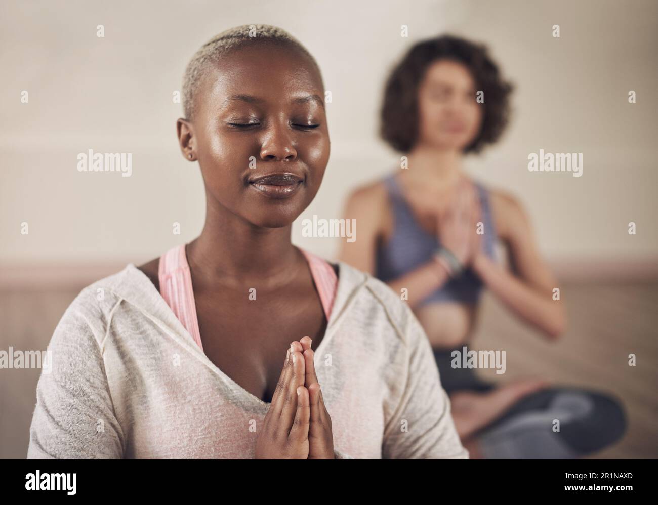 Meditation put this smile on my face. two young women sitting together ...