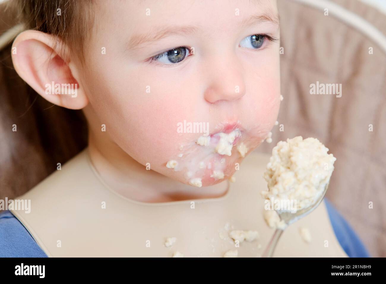 Baby mess eating oatmeal hi-res stock photography and images - Alamy