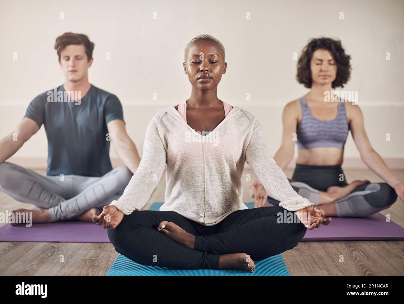 Connecting with my inner goddess. Full length shot of a diverse group ...