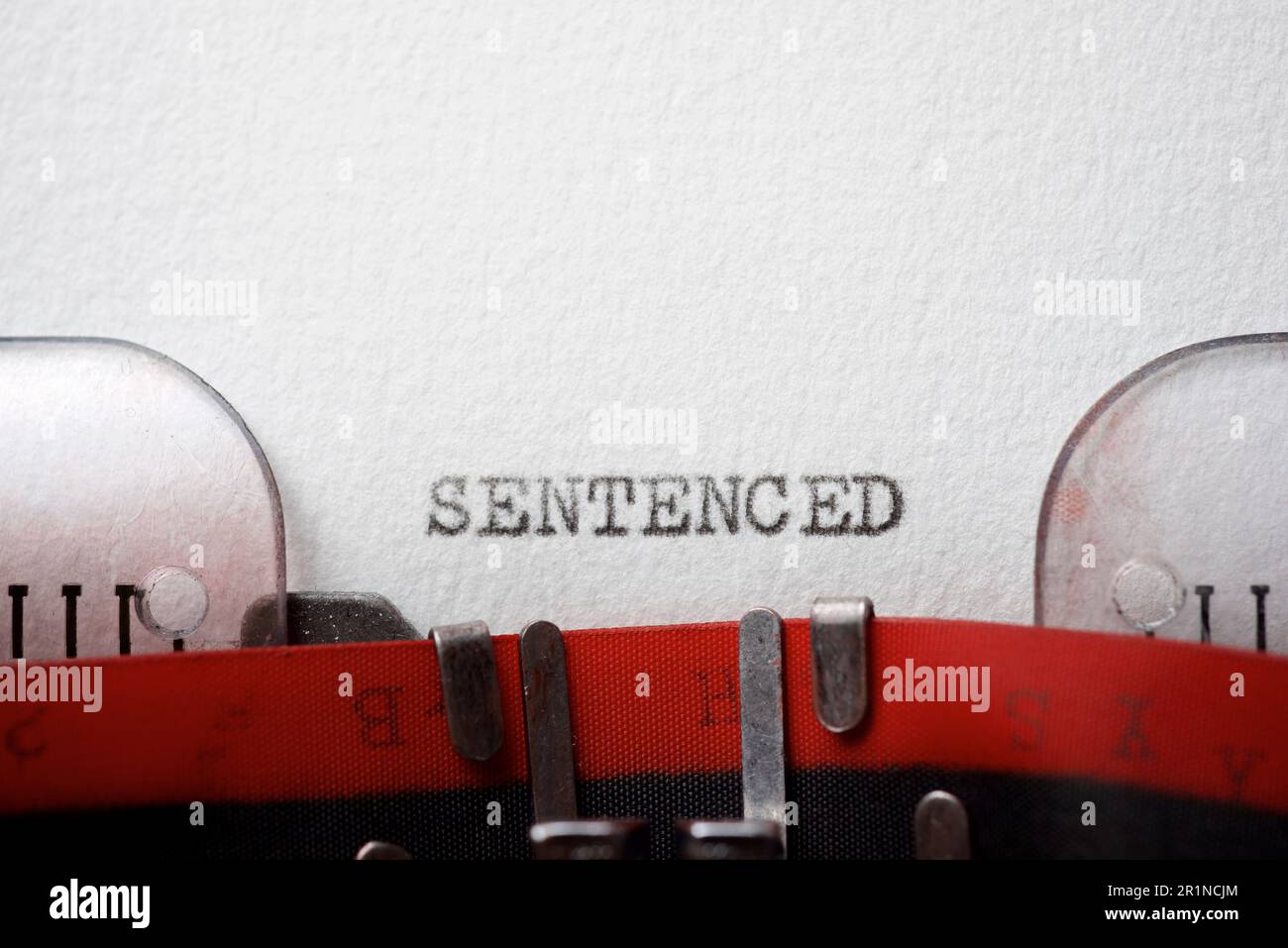 Sentenced word written with a typewriter Stock Photo - Alamy