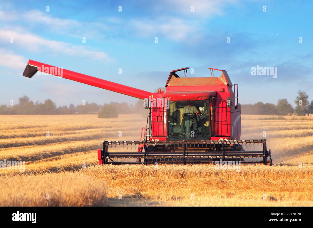 Combine harvester on field Stock Photo - Alamy