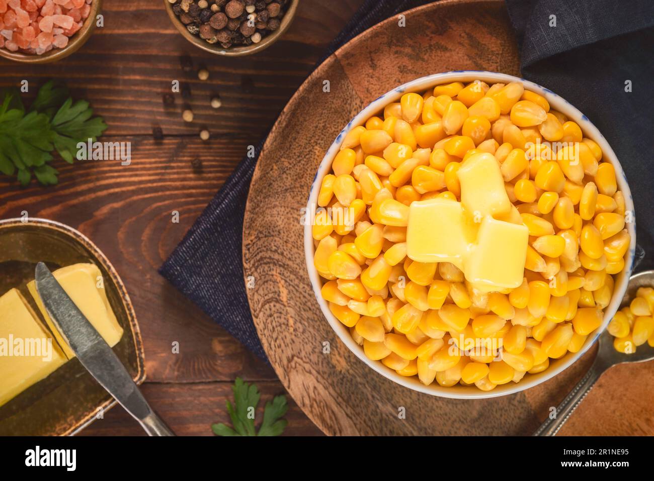 Sweet corn kernels in small bowl. Topped with delicious melted butter ...