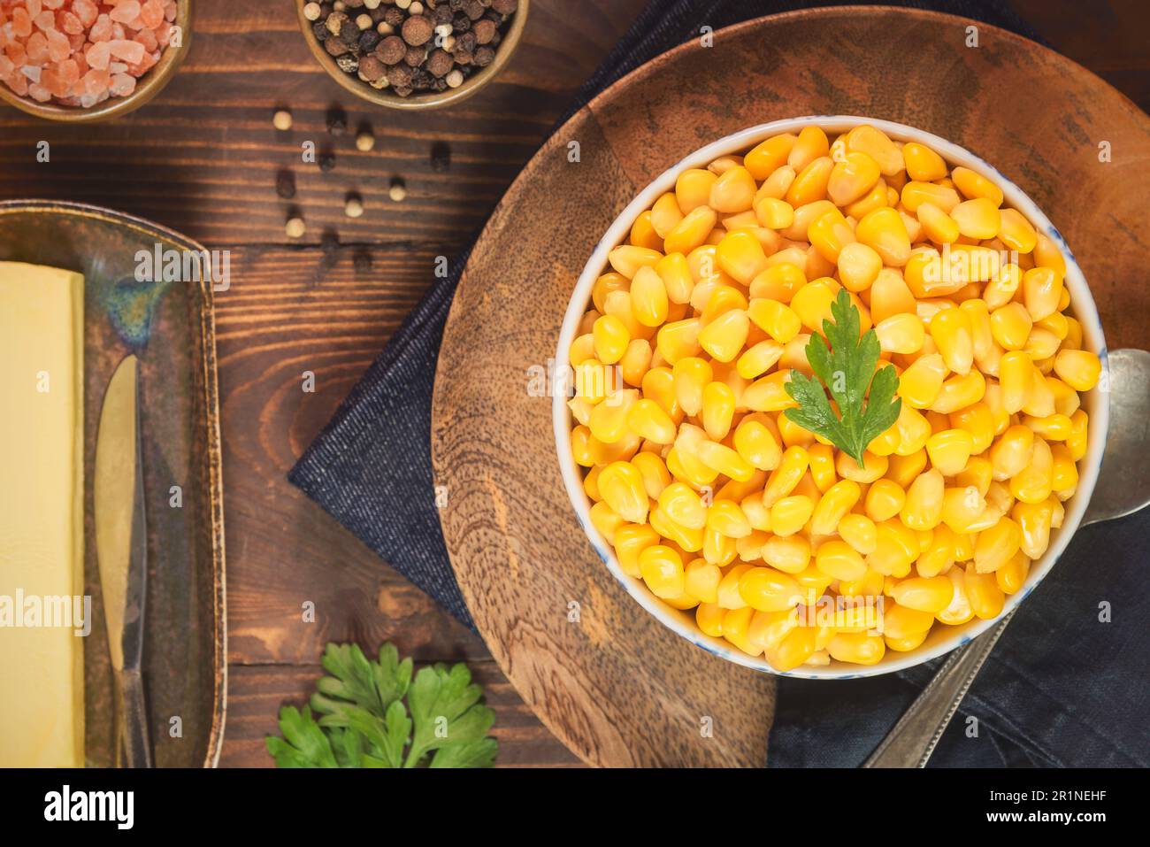 Sweet corn kernels in small bowl. Topped with delicious melted butter ...