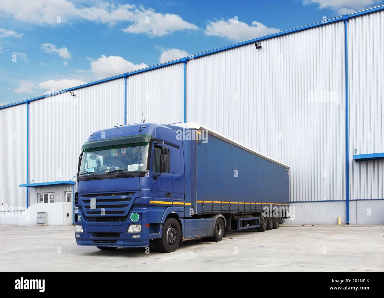 Truck at warehouse building Stock Photo - Alamy