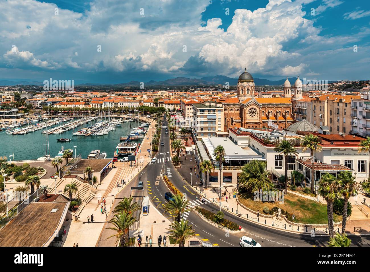 Aerial view of the city skyline, urban road and promenade along marina ...