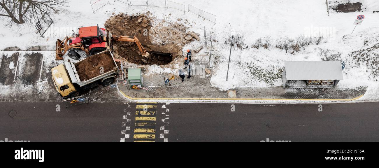 Group of construction workers on construction site. Heavy construction ...