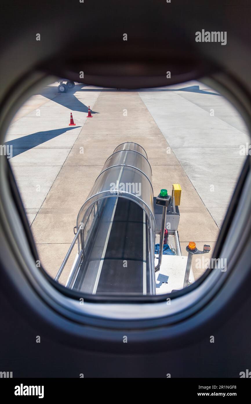 view through the window of the aircraft on the elevator for loading ...
