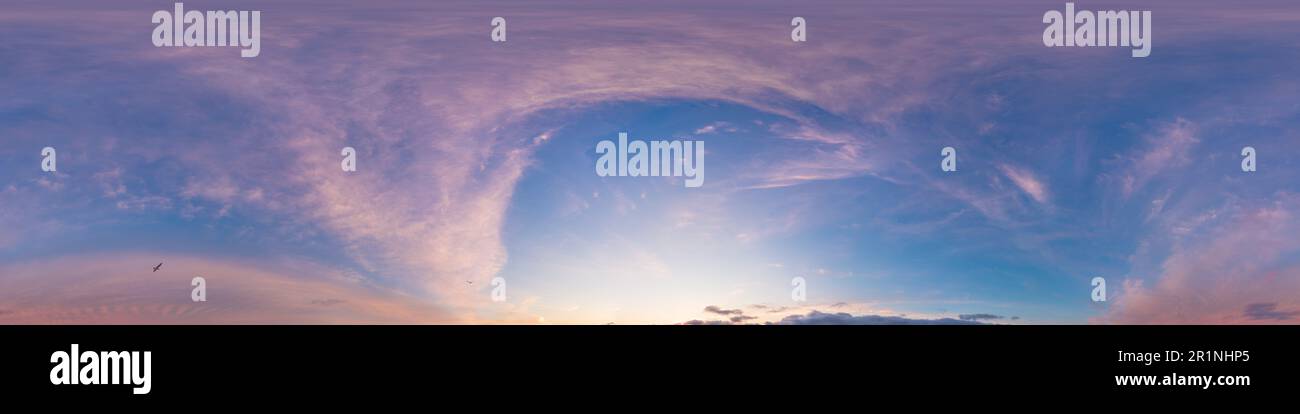 Bright sunset sky panorama with glowing red pink Cirrus clouds. HDR 360 ...