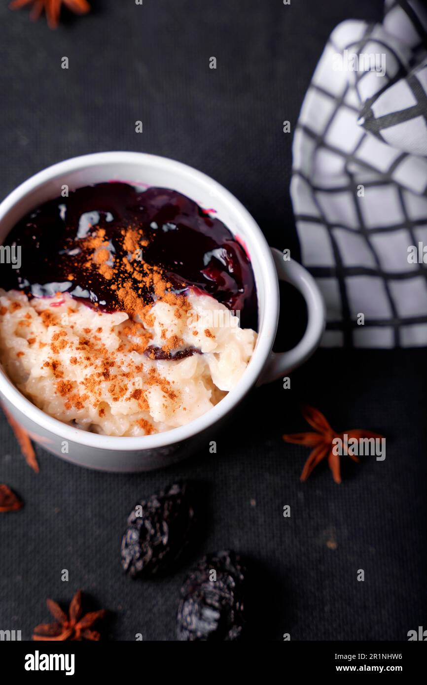 A typical Peruvian dessert with rice pudding and purple mazamorra Stock ...