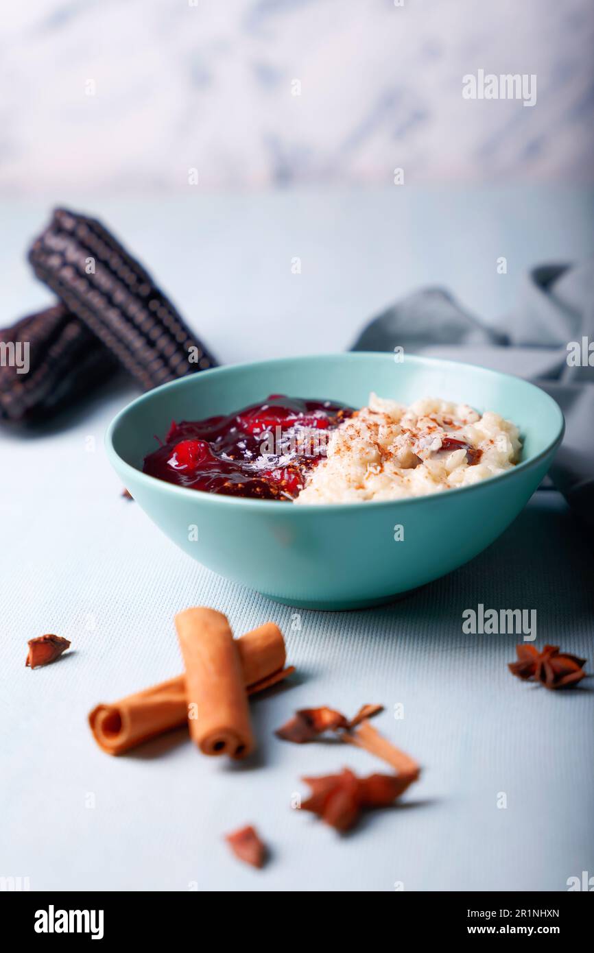 A typical Peruvian dessert with rice pudding and purple mazamorra Stock ...