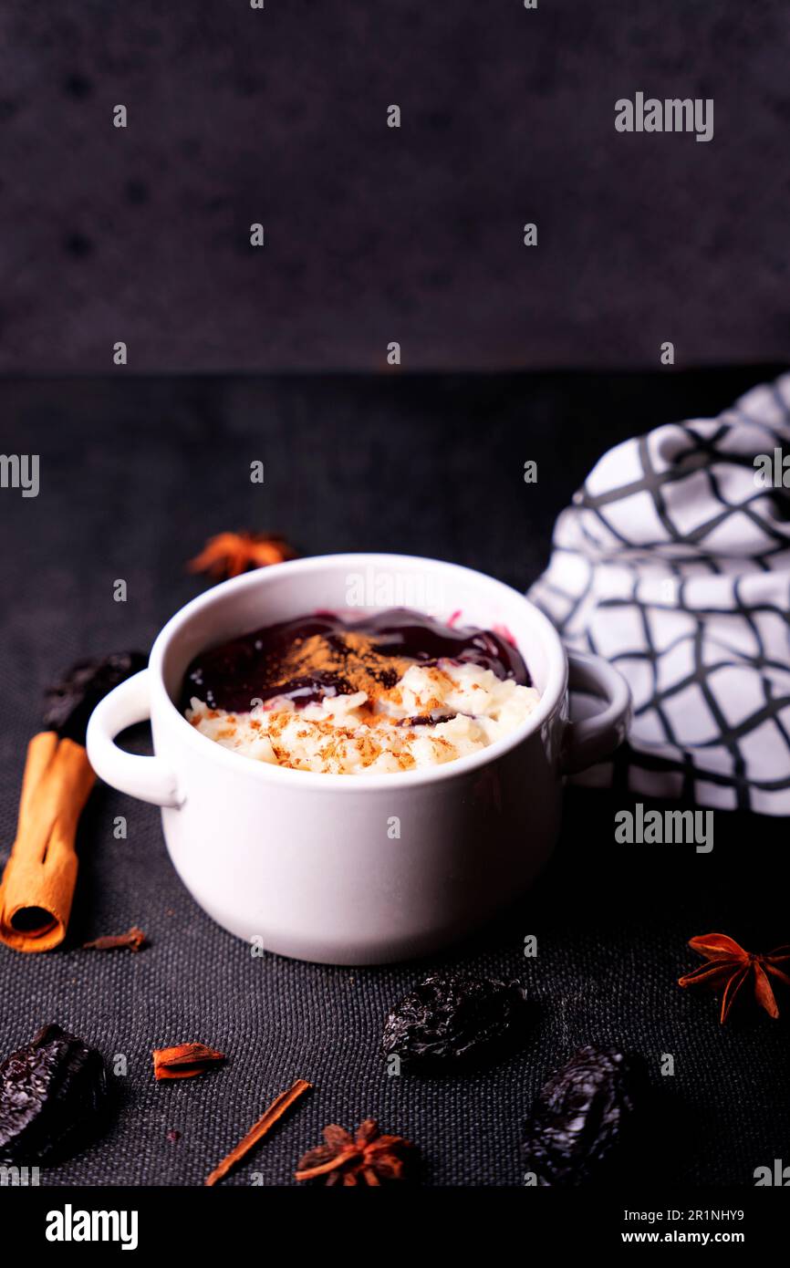 A typical Peruvian dessert with rice pudding and purple mazamorra Stock ...