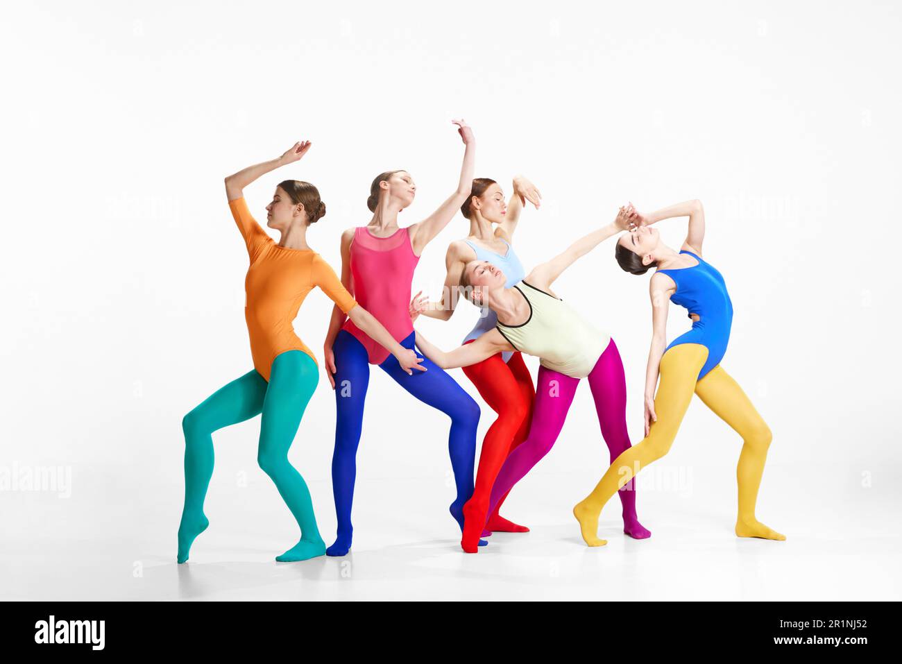 Expressive dance. Stylish, young girls, ballet dancers in bright ...