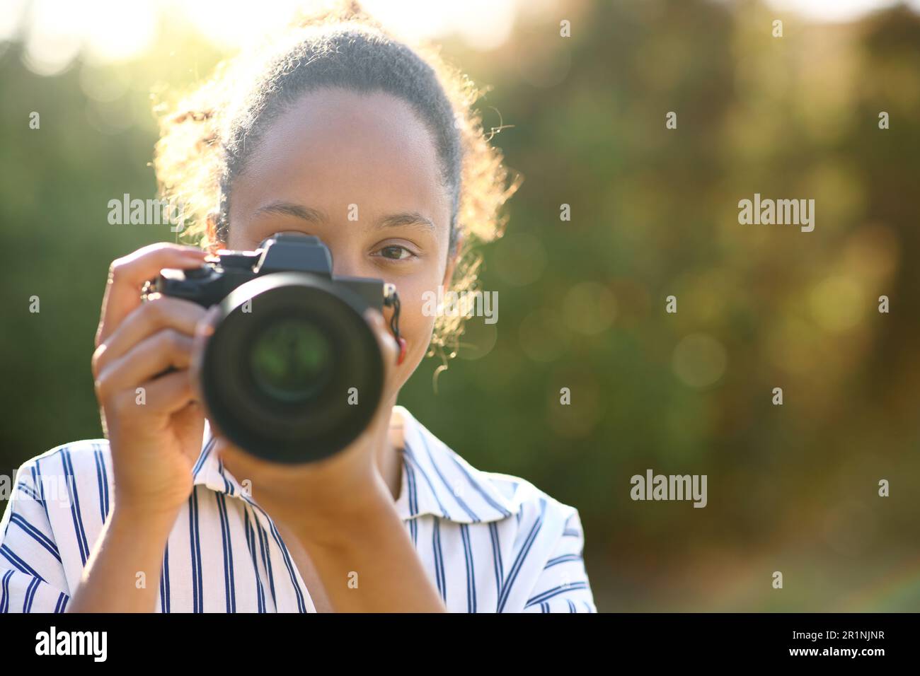 Front view of a black photographer taking photo of you Stock Photo - Alamy