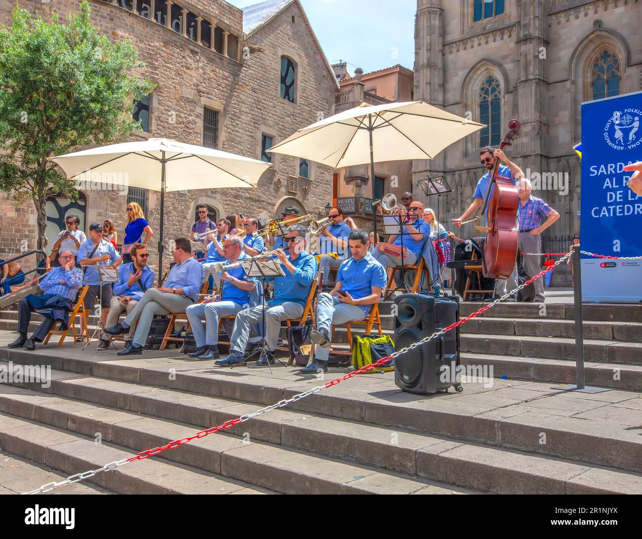 The orchestra of musicians plays music in the square in front of the ...