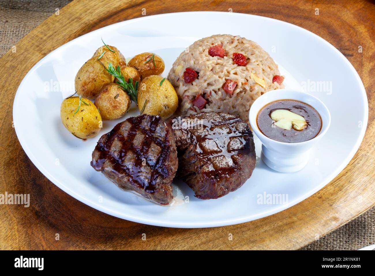 Roasted steak meat, potatoes and rice Stock Photo - Alamy