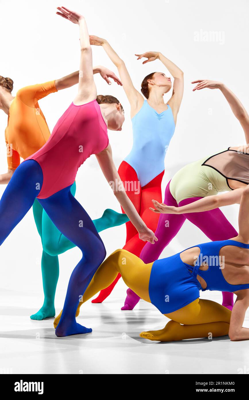 Modern choreography. Group of young girls, ballet dancers in colorful ...