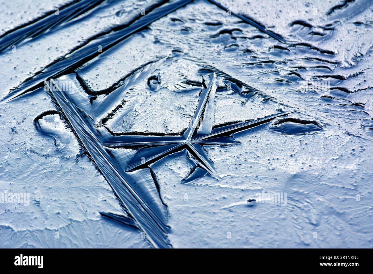 Frozen pond with ice structure Stock Photo - Alamy